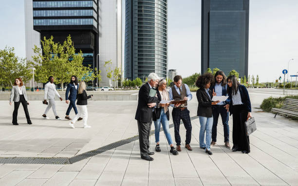 Free Stock Photo of A group of people standing outside a building ...