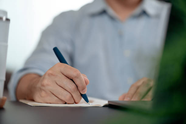 Free picture: desk, man hold a pencil, student, book, pencil, education