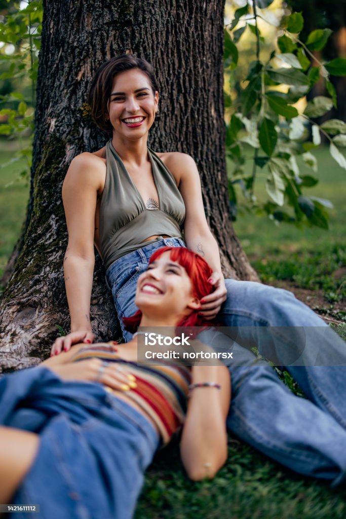 Beautiful Lesbian Girl Looking At The Camera While Her Girlfriends