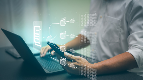 Businesspeople Manage Corporate Document Databases Through The Cloud ... Businesspeople Manage Corporate Document Databases Through The Cloud ...