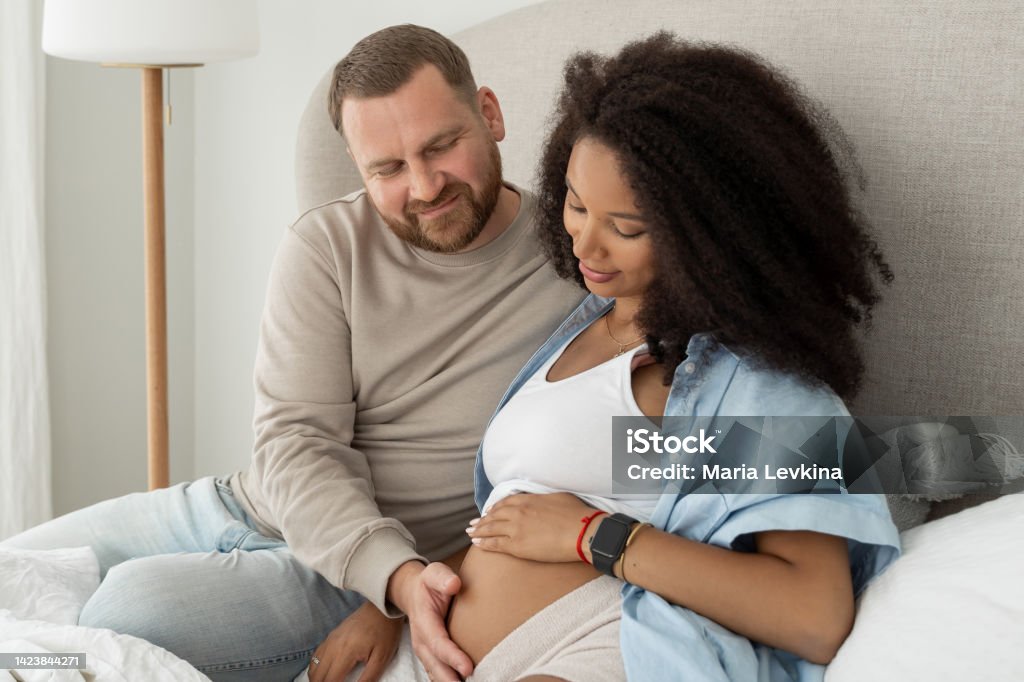 White Man Touching Belly Of His Pregnant Black Wife Pregnant Woman And