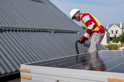 African Man Installing Solar Panels Stock Photo - Download Image Now ... African Man Installing Solar Panels Stock Photo - Download Image Now ...