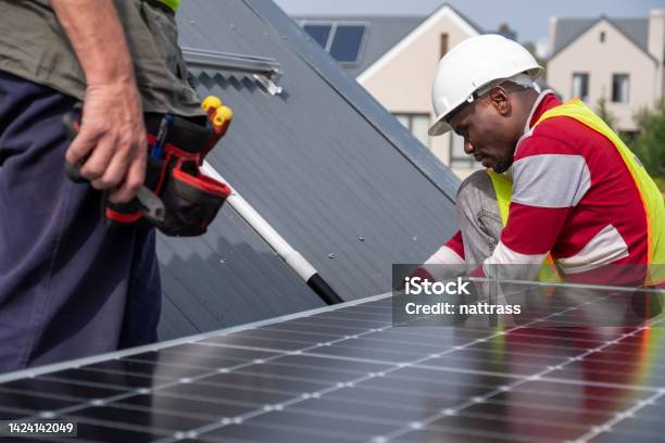 African Man Installing Solar Panels Stock Photo - Download Image Now ... African Man Installing Solar Panels Stock Photo - Download Image Now ...