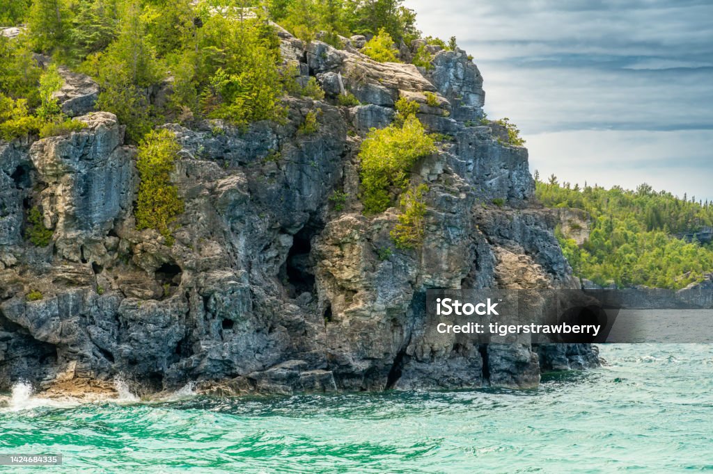 Indian Head Cove At Tobermory Turquoise Blue Water And Green Pine Forest In Ontario Canada