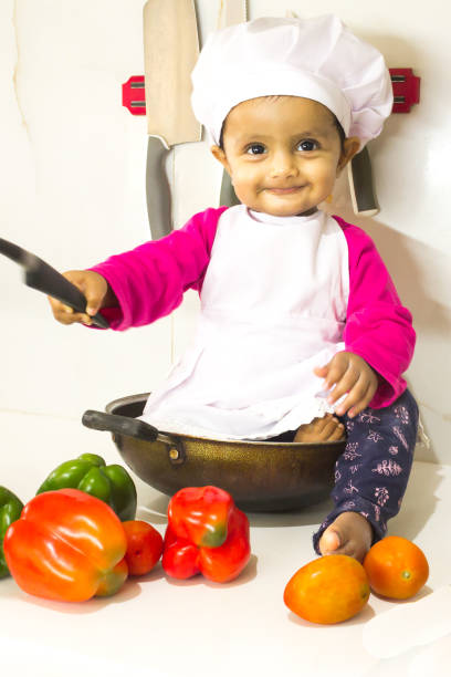 Free Stock Photo of Cute baby chef in a big pot with vegetables ...