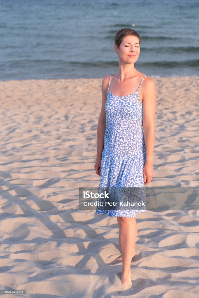 Attractive Short Haired Woman In Her Thirties Wear In Light Summer