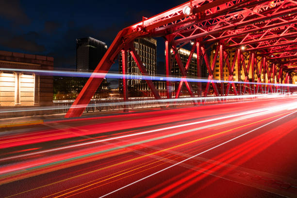 Free Stock Photo of Nighttime cityscape with light trails and bridge ...