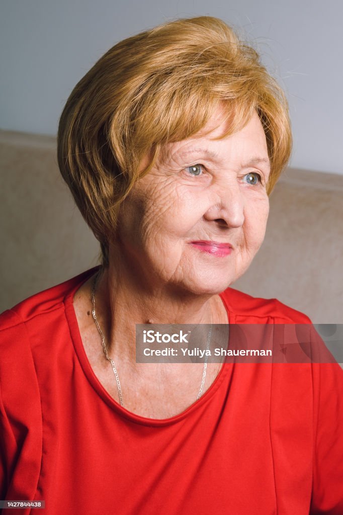 Portrait Of A Beautiful Smiling 82 Year Old Woman Grandma Looks Away ... Portrait Of A Beautiful Smiling 82 Year Old Woman Grandma Looks Away ...