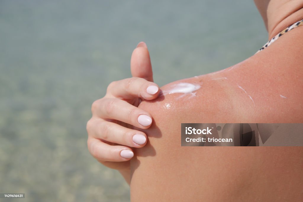 Woman Applying Sunscreen Cream On Her Shoulder Sun Protection Skin Care