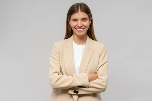 560 Portrait Of Smiling Business Woman With Folded Hands Isolated On