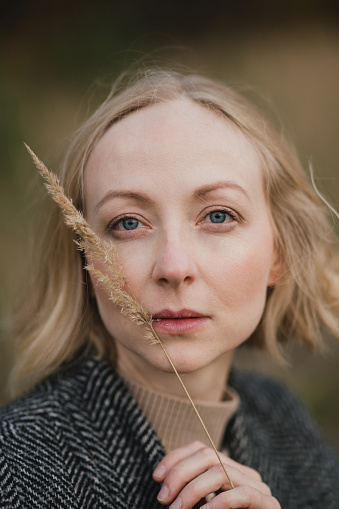 Beautiful Stylish Caucasian Woman Walking And Spending Time In Colorful Autumn Forest Stock