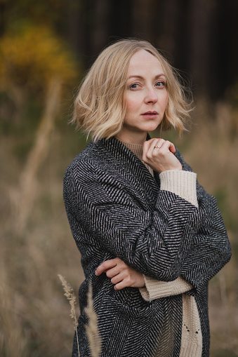 Beautiful Stylish Caucasian Woman Walking And Spending Time In Colorful Autumn Forest Stock