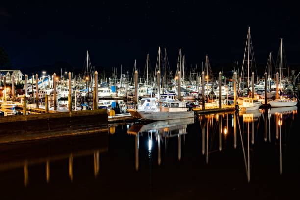 Free Stock Photo of Nighttime harbor with boats and their reflections ...