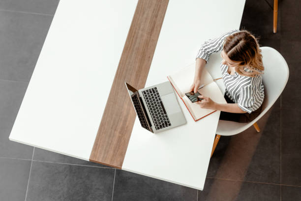 Free Stock Photo of Businesswoman working on laptop in office - looking ...