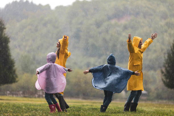 Free Stock Photo of Family having fun in colorful raincoats | Download ...