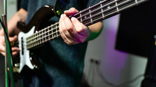 Free Stock Photo of Bass guitarist in partial view performing ...