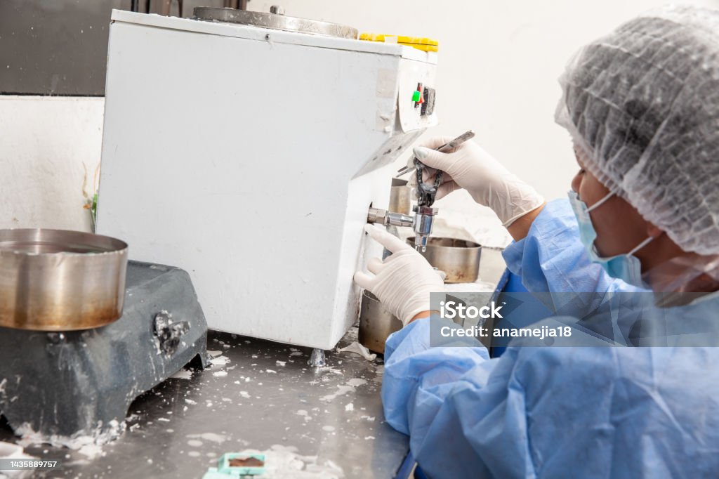 Scientist Embedding Tissues In Paraffin Blocks For Sectioning Pathology