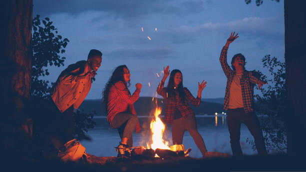 Free Stock Photo of Group of People Standing Around a Fire | Download ...
