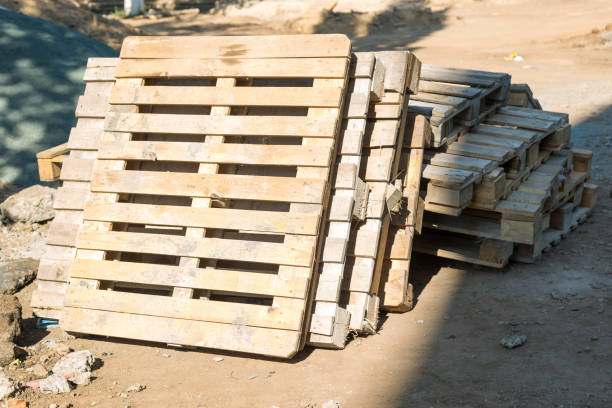Free Stock Photo of Pile of Wooden Pallets Beside a Building | Download ...