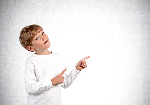 Free Stock Photo of Young Boy Pointing at Something in the Distance ...
