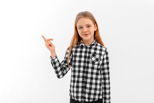 Portrait Of Happy Cute Teen Girl Pointing Finger Up Caucasian Girl