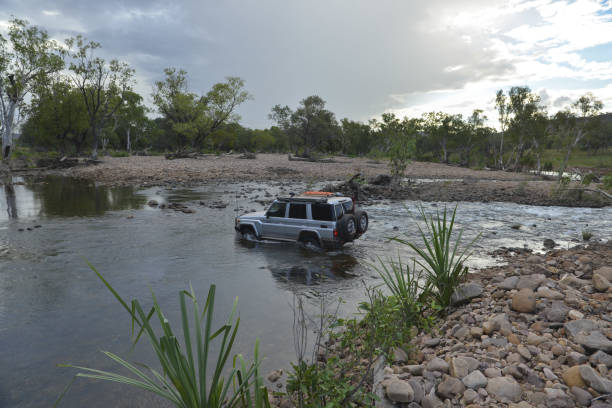 Free Stock Photo of An off-road vehicle crossing a shallow river ...