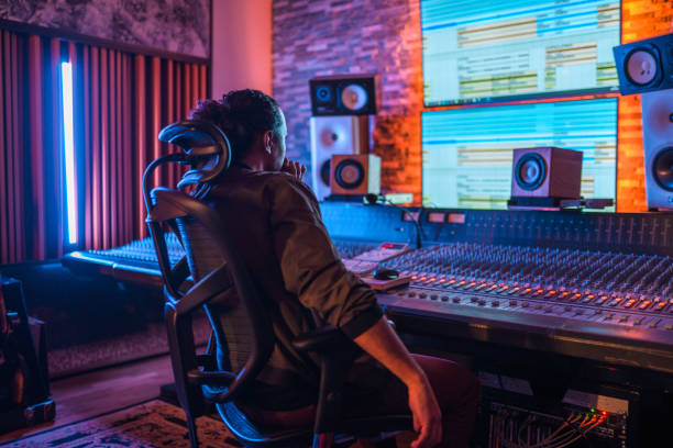 Free Stock Photo of Man Operating Sound Board in Recording Studio ...