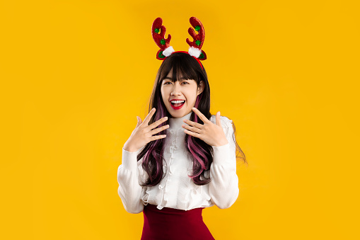 Asian Pretty Woman In White Blouse Red Skit Wear Reindeer Horns