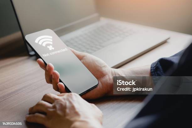 Man Using A Mobile Phone To Connect To Wifi But Wifi Not Connected And