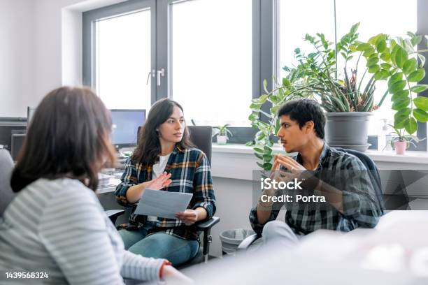 Group Of Three People Having Meeting At Shipping Company Office Stock ... Group Of Three People Having Meeting At Shipping Company Office Stock ...