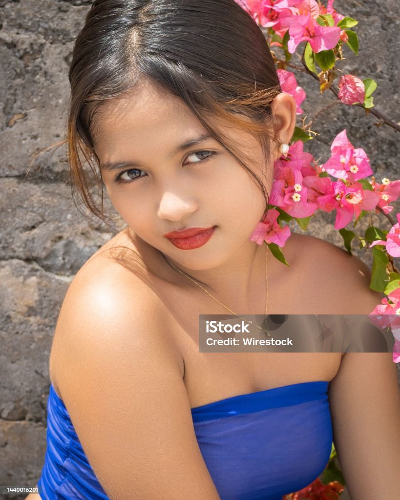 Portrait Of Beautiful Filipino Girl Posing In Front Of Camera On Capinticillo Island Philippines