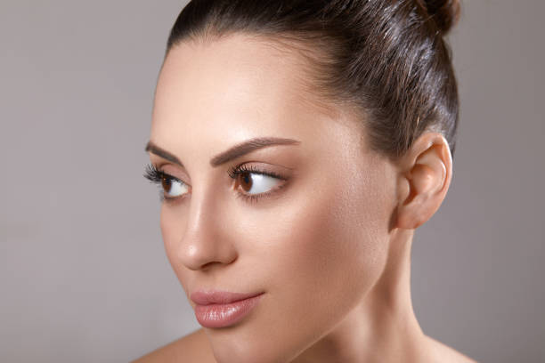 150 Young Beautician Applying Lip Balm On Beautiful Woman Fotos De