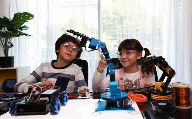 Free Stock Photo of Kids learning about robotics in a group technology ...