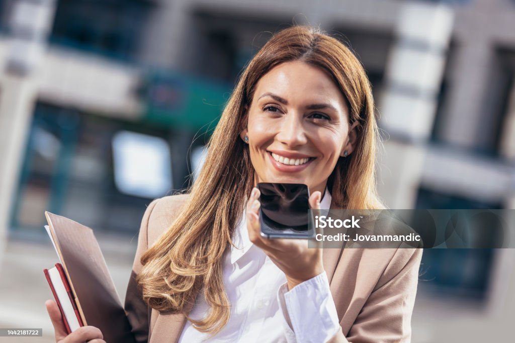 Corporate Woman Records Voice Message On Smartphone Talks Into ... Corporate Woman Records Voice Message On Smartphone Talks Into ...
