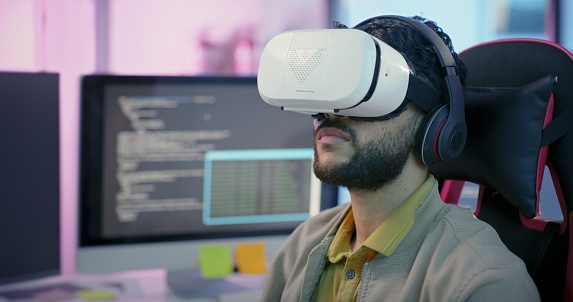 Man With Computer Coding Programmer With Vr Headset And Working With