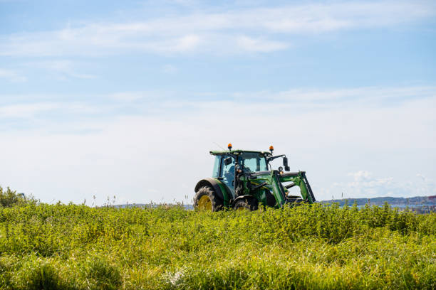 Free Stock Photo of Tractor Driving Through Field of Grass | Download ...