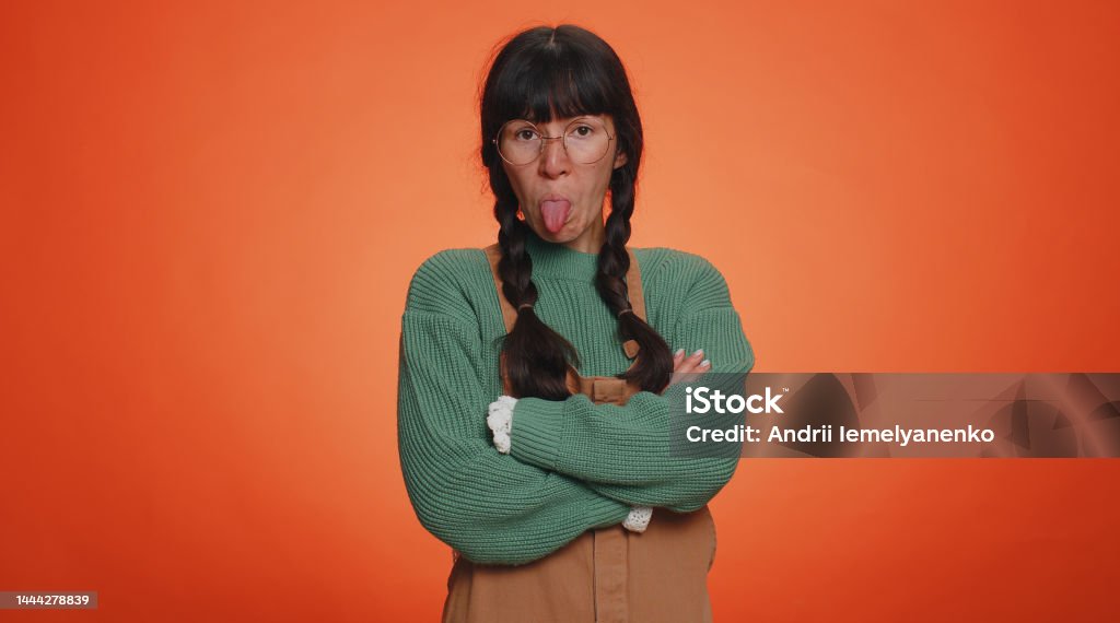 Funny Nerd Woman Showing Tongue Making Faces At Camera Fooling Around