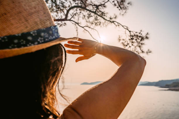 Free Stock Photo of Woman shielding her eyes from the sun | Download ...