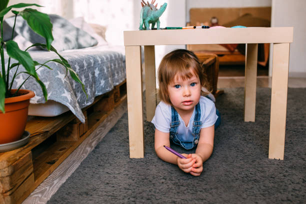 Free Stock Photo of Child playing under chair unseen face | Download ...