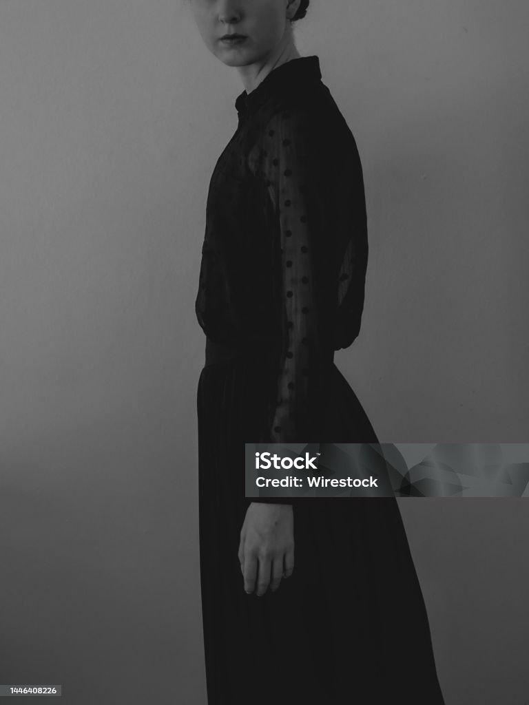Beautiful Caucasian Girl In Black Victorianstyle Dress Standing Against