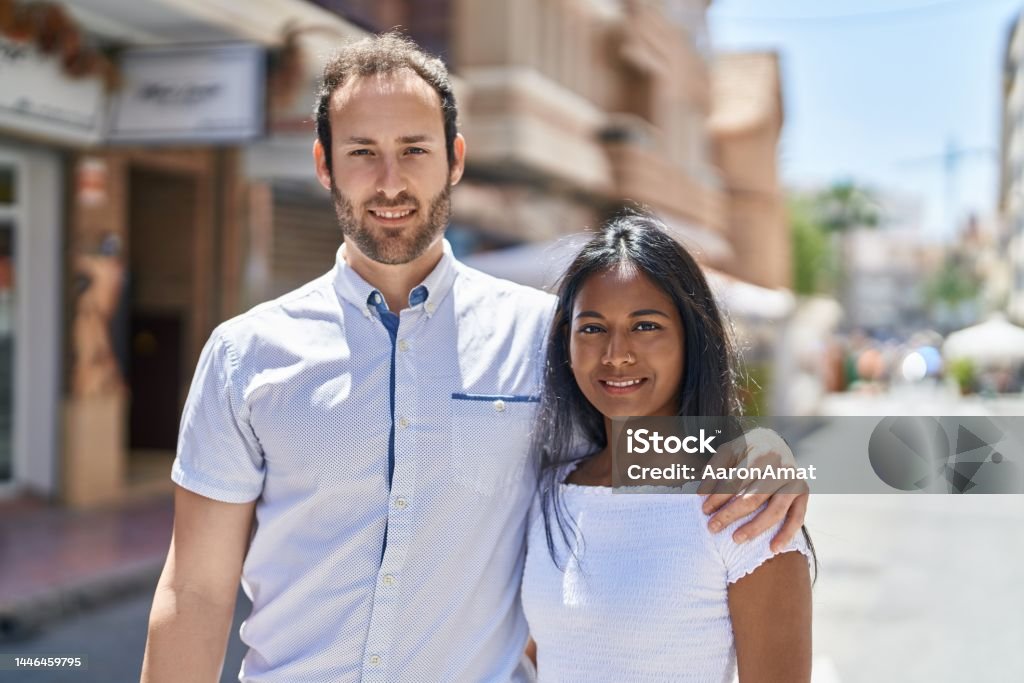 Man And Woman Interracial Couple Hugging Each Other At Street Stock