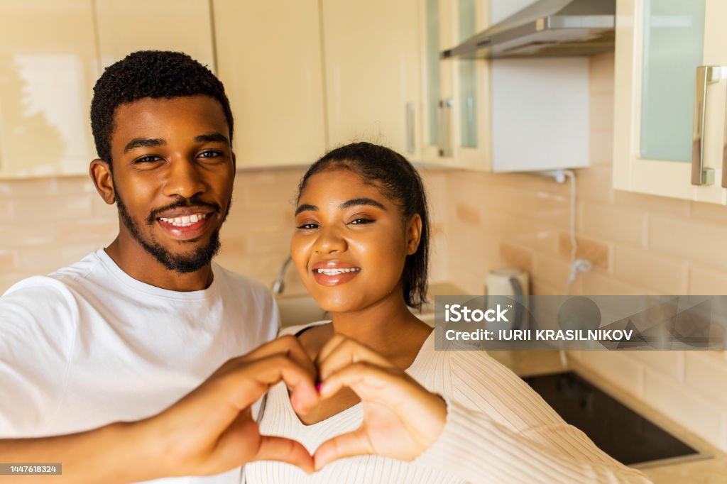 Young Happy Mixed Race Couple Spending Their Time At Home In The