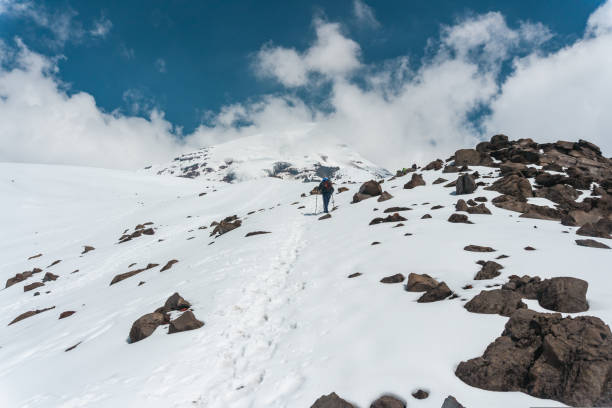 Free Stock Photo of Man Hiking Up Snow-Covered Mountain | Download Free ...