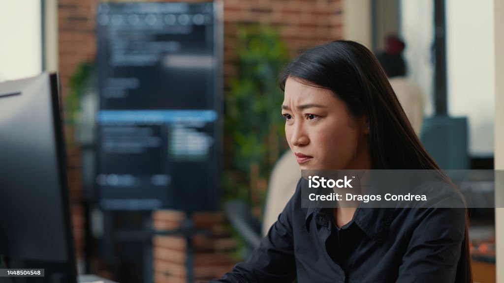 Portrait Of Infuriated Software Developer Focused On Writing Code After Encountering Unexpected