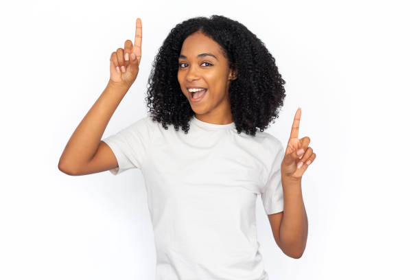 Free Stock Photo of Woman pointing at blank copyspace above her head ...
