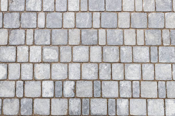 Free Stock Photo of Close-up view of a gray cobblestone pavement with ...