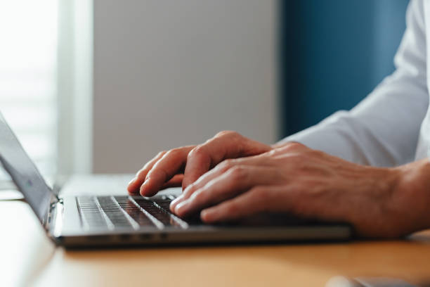 Free Stock Photo of Close up of a person typing on the laptop viewing ...