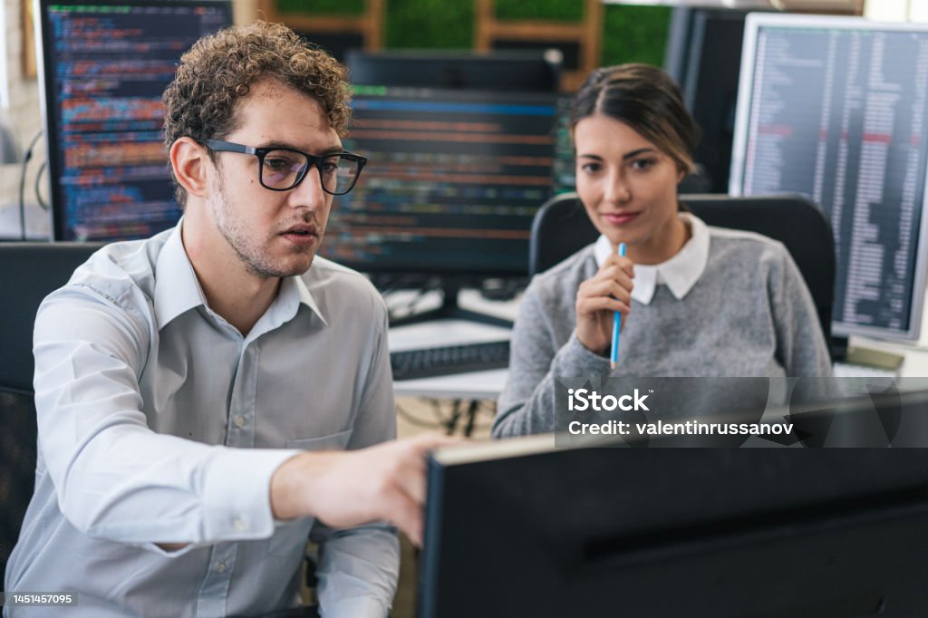 Software Programmers Analyzing Html Code And Database Brainstorming Script Ideas To Develop New