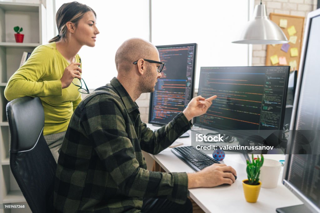 Software Programmers Analyzing Html Code And Database Brainstorming Script Ideas To Develop New