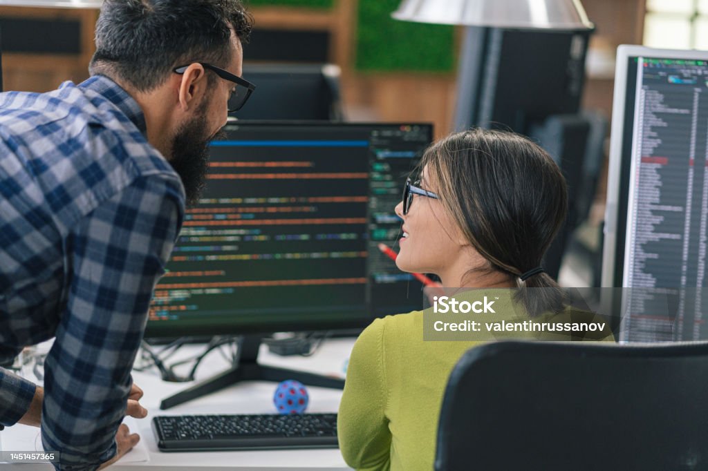 Software Programmers Analyzing Html Code And Database Brainstorming Script Ideas To Develop New